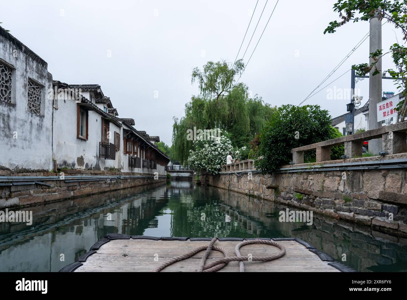 Suzhou, China - June 11, 2024 : A narrow canal winds through a historic ...