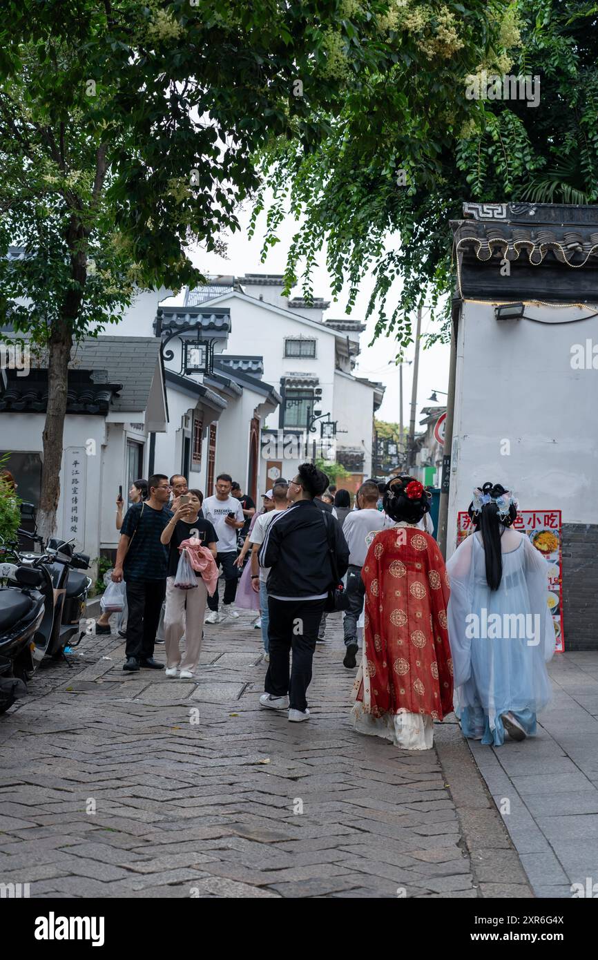Suzhou, China - June 11, 2024 : A cobblestone street lined with white ...