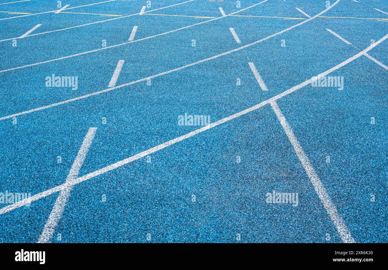 Olympic stadium blue tartan track - texture Stock Photo - Alamy