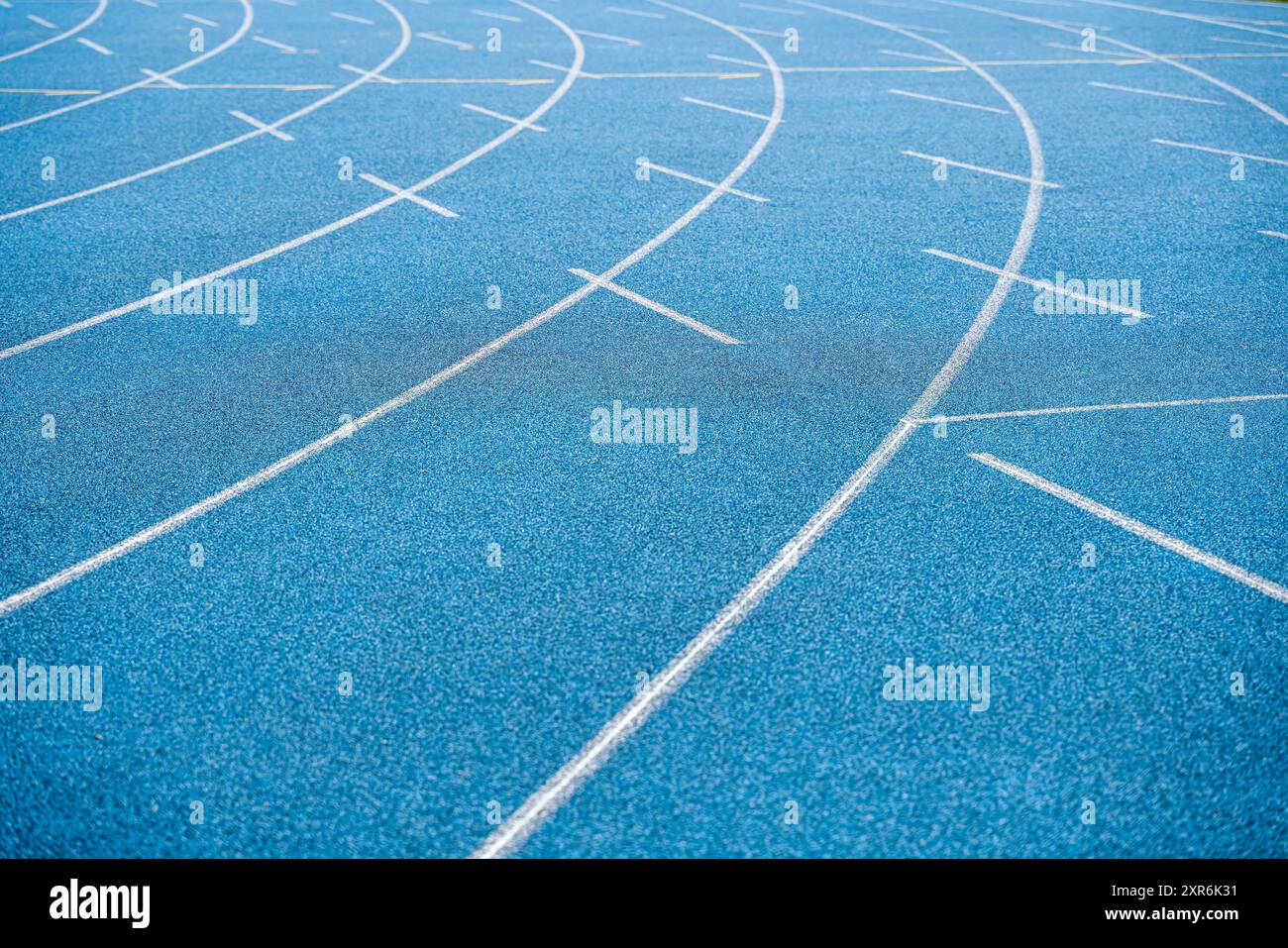 Olympic stadium blue tartan track - texture Stock Photo - Alamy