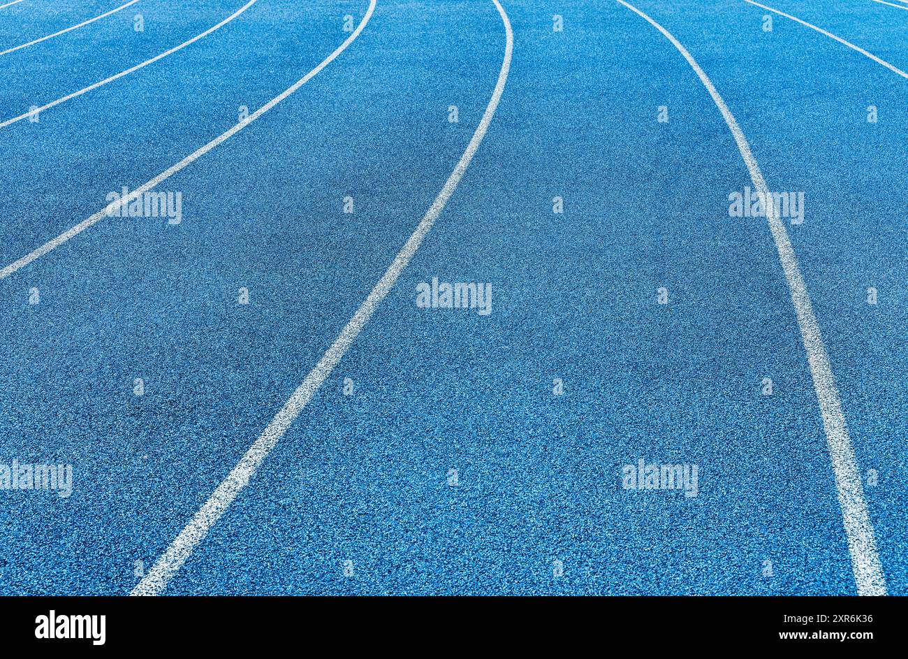 Olympic stadium blue tartan track - texture Stock Photo - Alamy