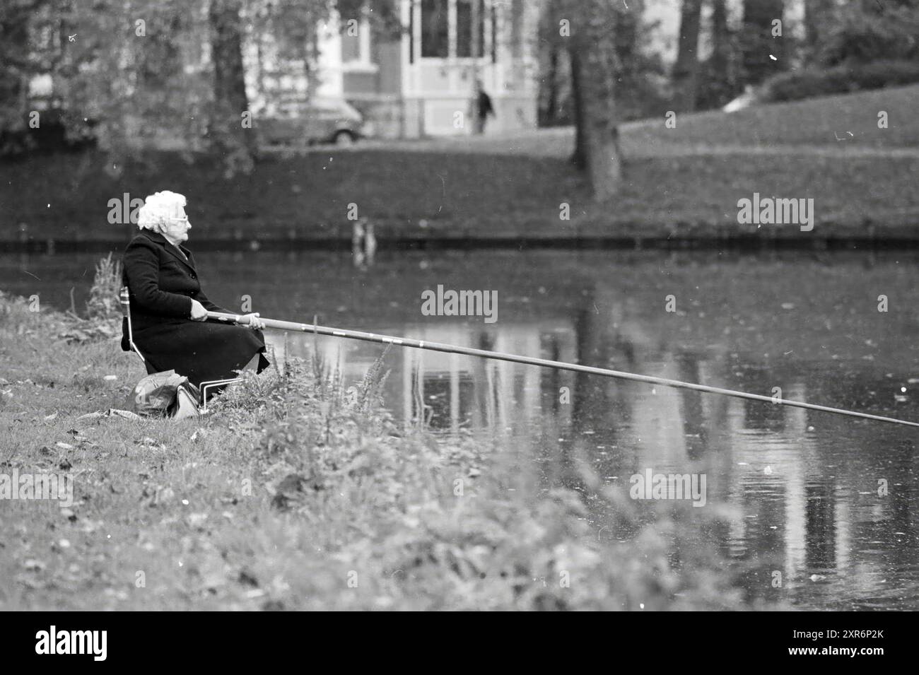 Old lady fishing rod hi-res stock photography and images - Alamy