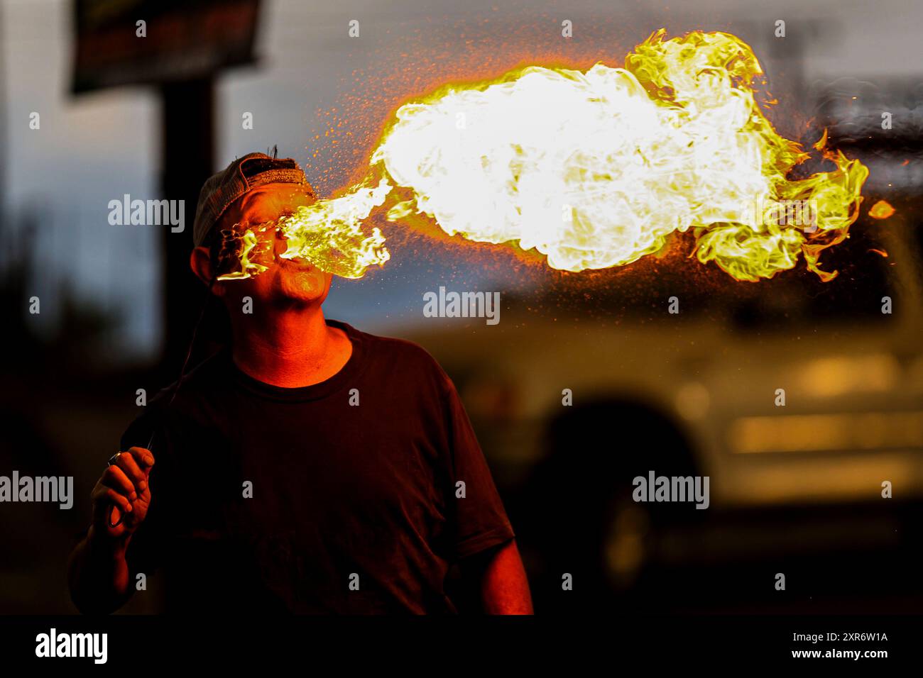 A man known as a fire-eater puts petroleum in his mouth which he uses ...