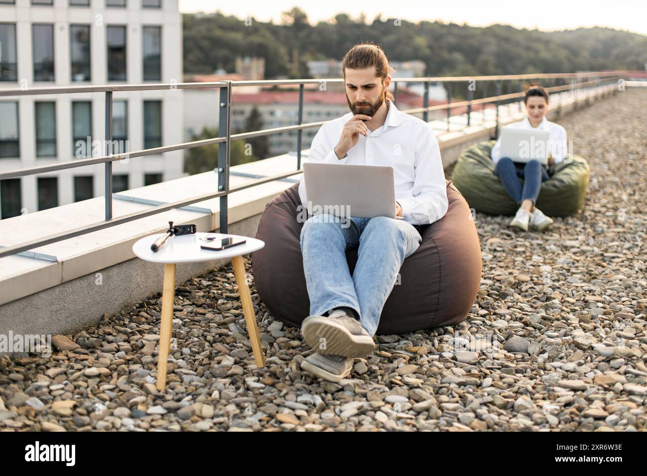 Bearded man working remotely outdoors hi-res stock photography and ...