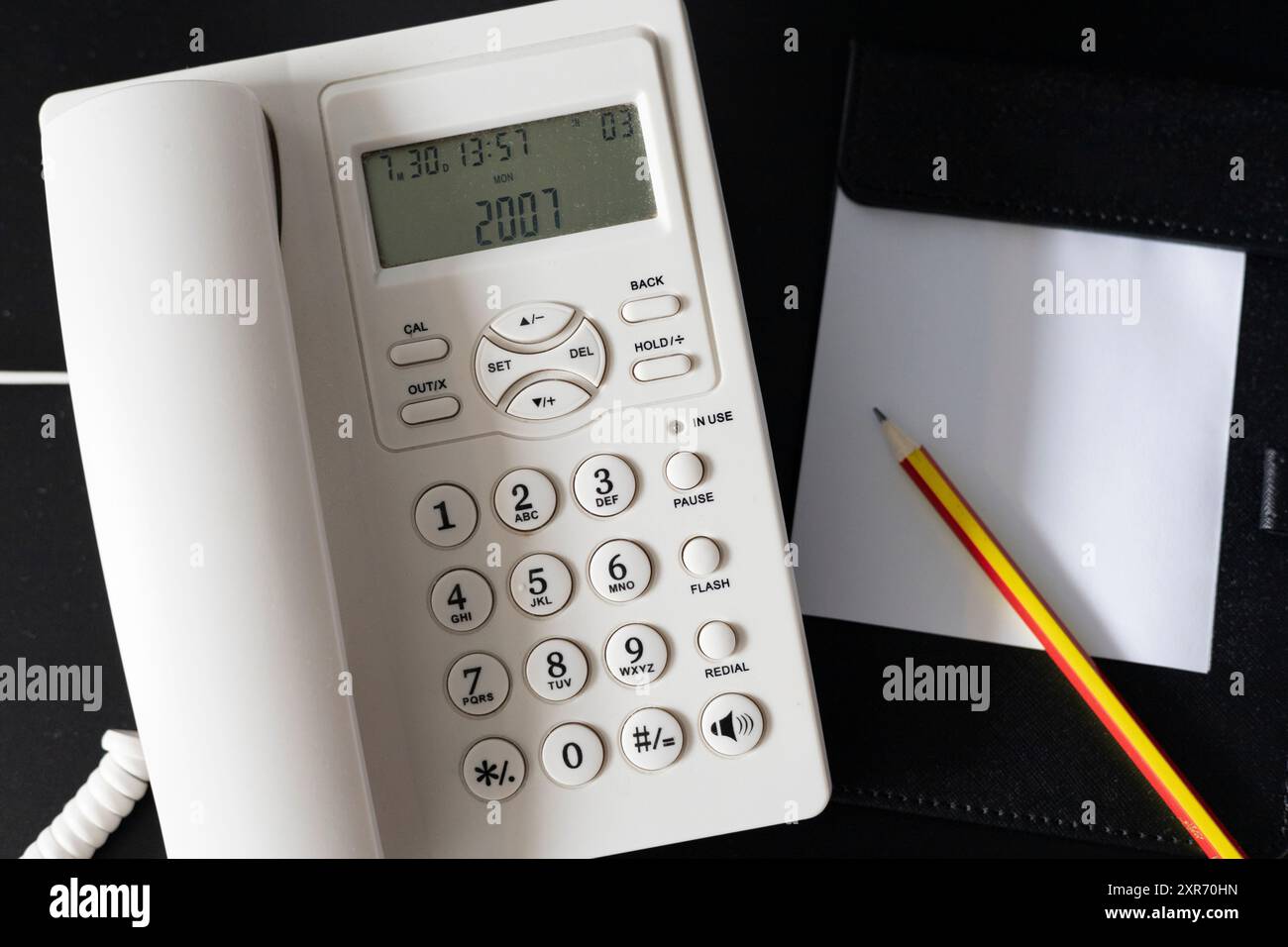Office Desk Essentials: A Phone, Notepad, Pencil, and Keyboard on a ...