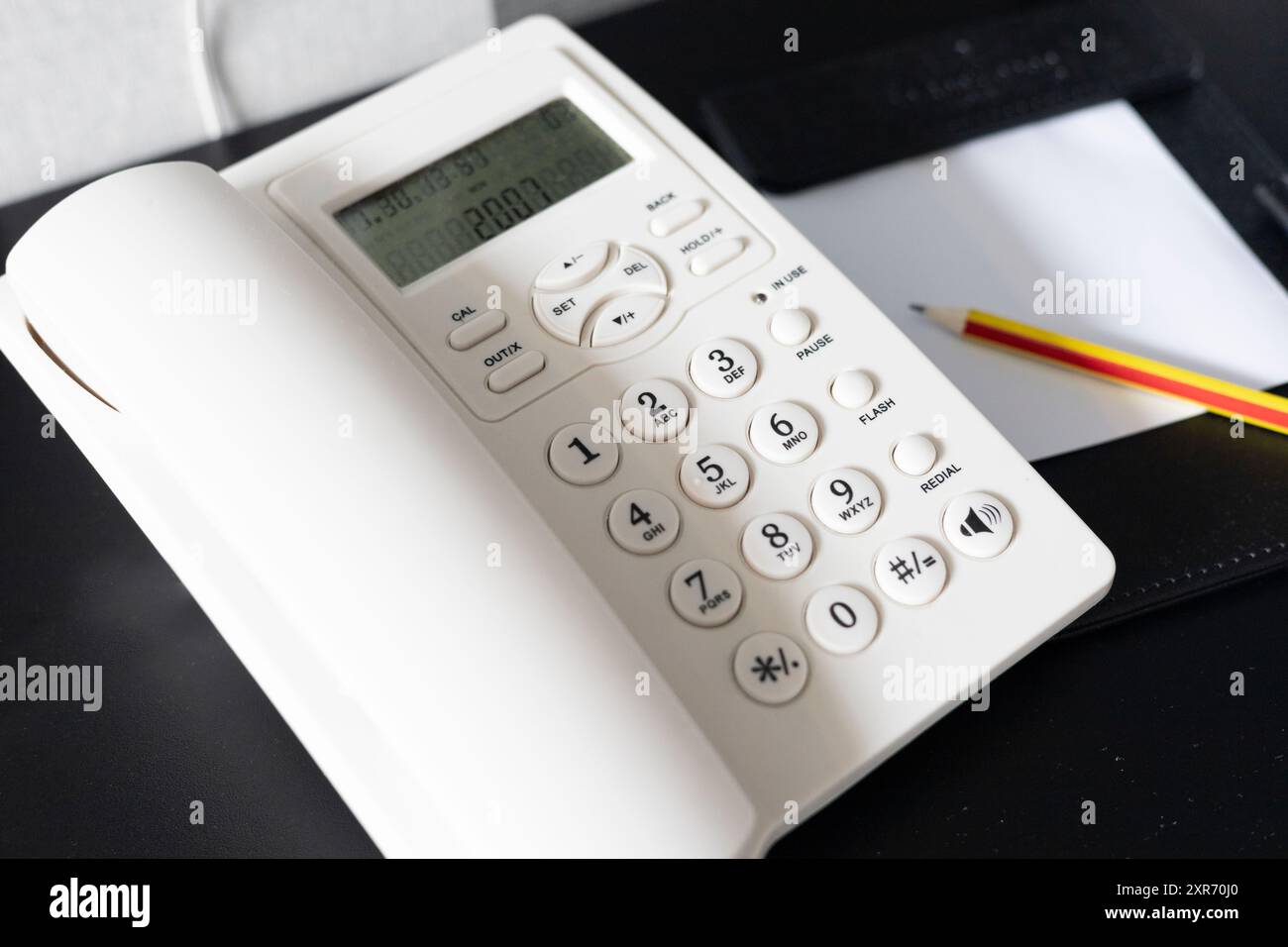 Office Desk Essentials: A Phone, Notepad, Pencil, and Keyboard on a ...