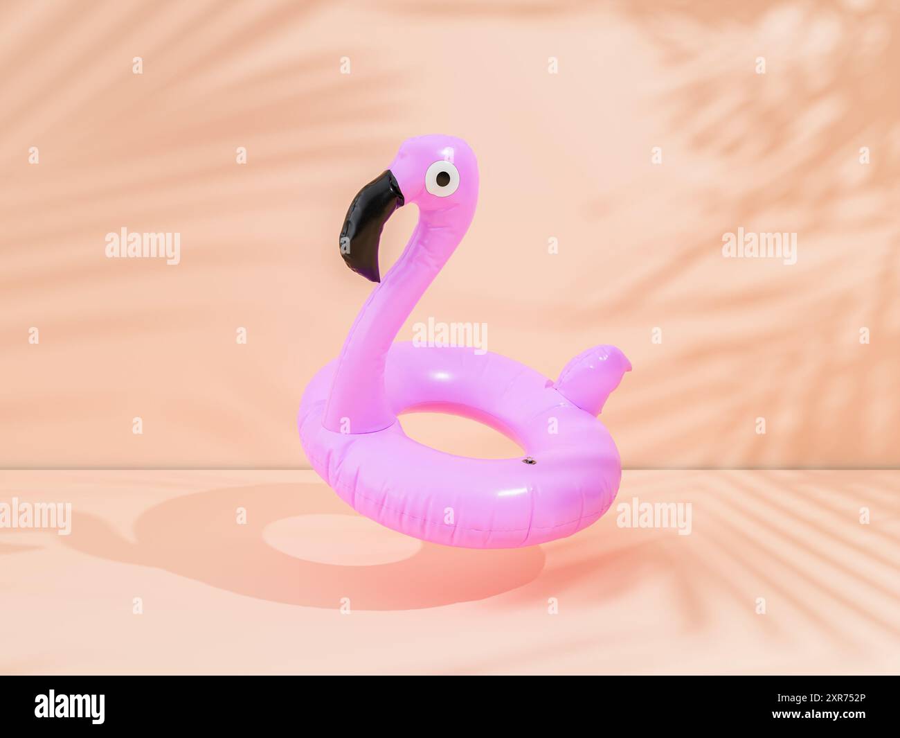 3D rendering of a pink flamingo float on a peach studio background with artistic palm leaf ...