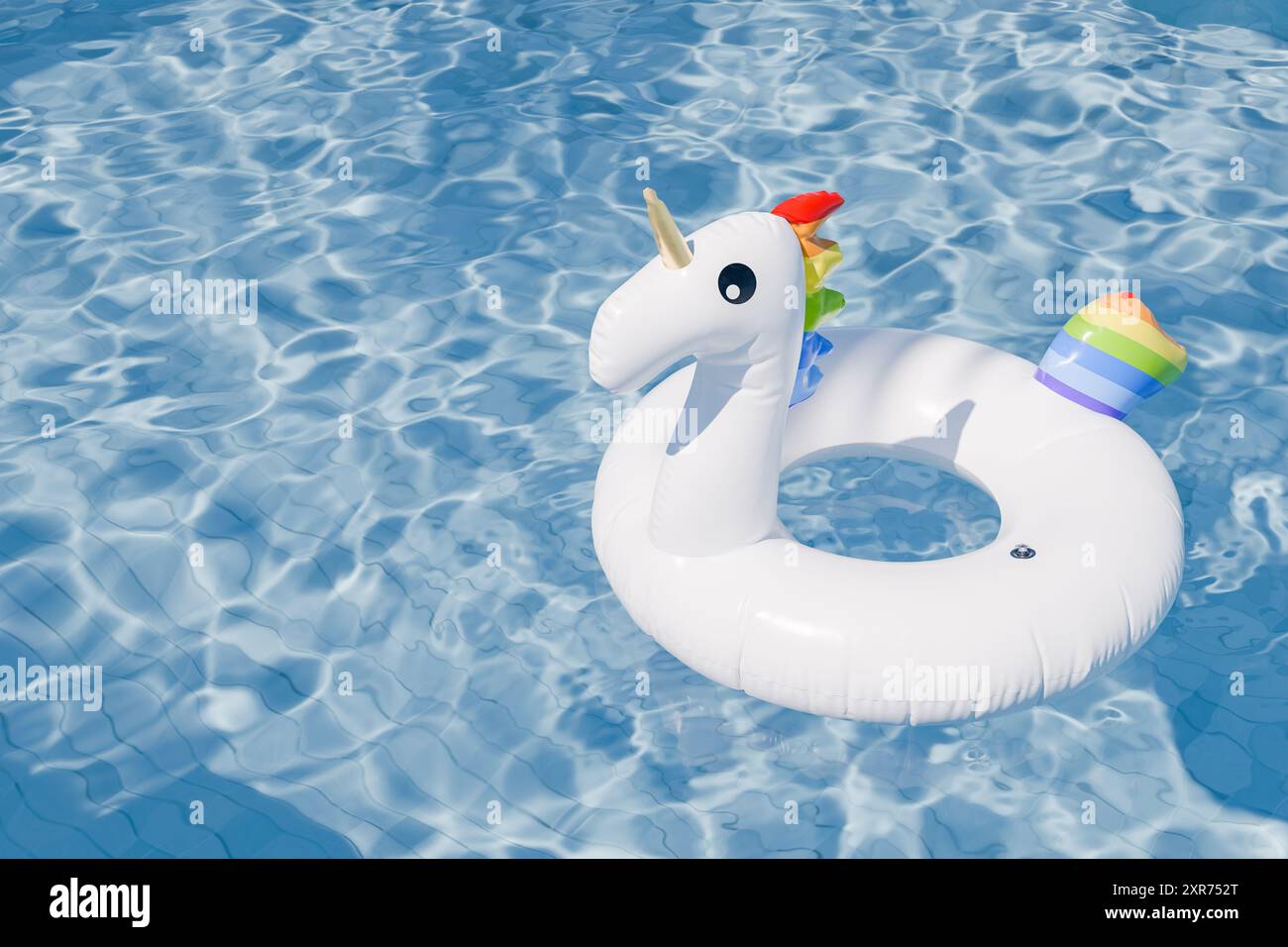 3D rendering of an inflatable unicorn float in a swimming pool with ...