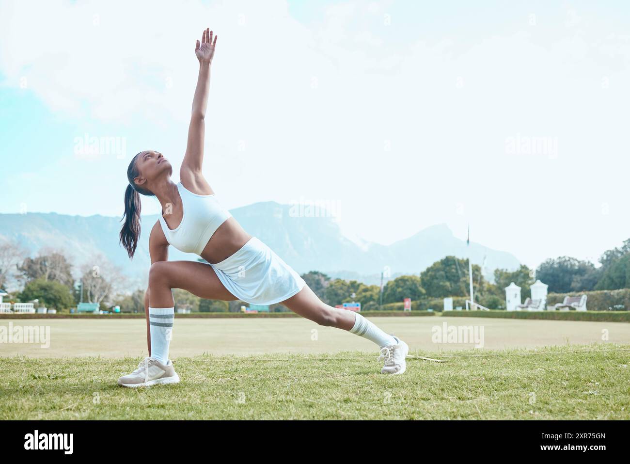 Woman, stretching arms and outdoor game on field, warm up and netball ...