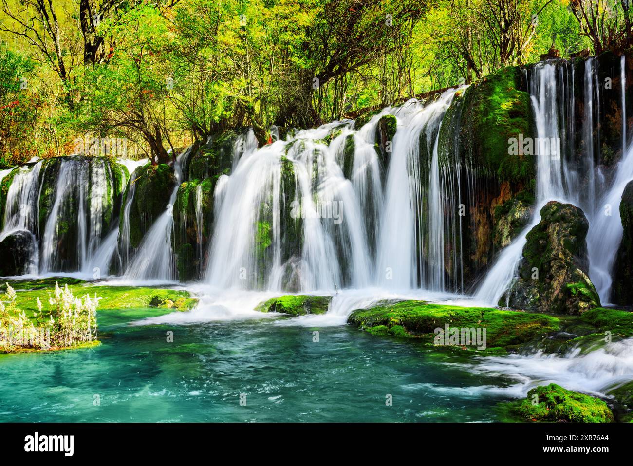 Amazing waterfall and azure lake with crystal clear water Stock Photo ...