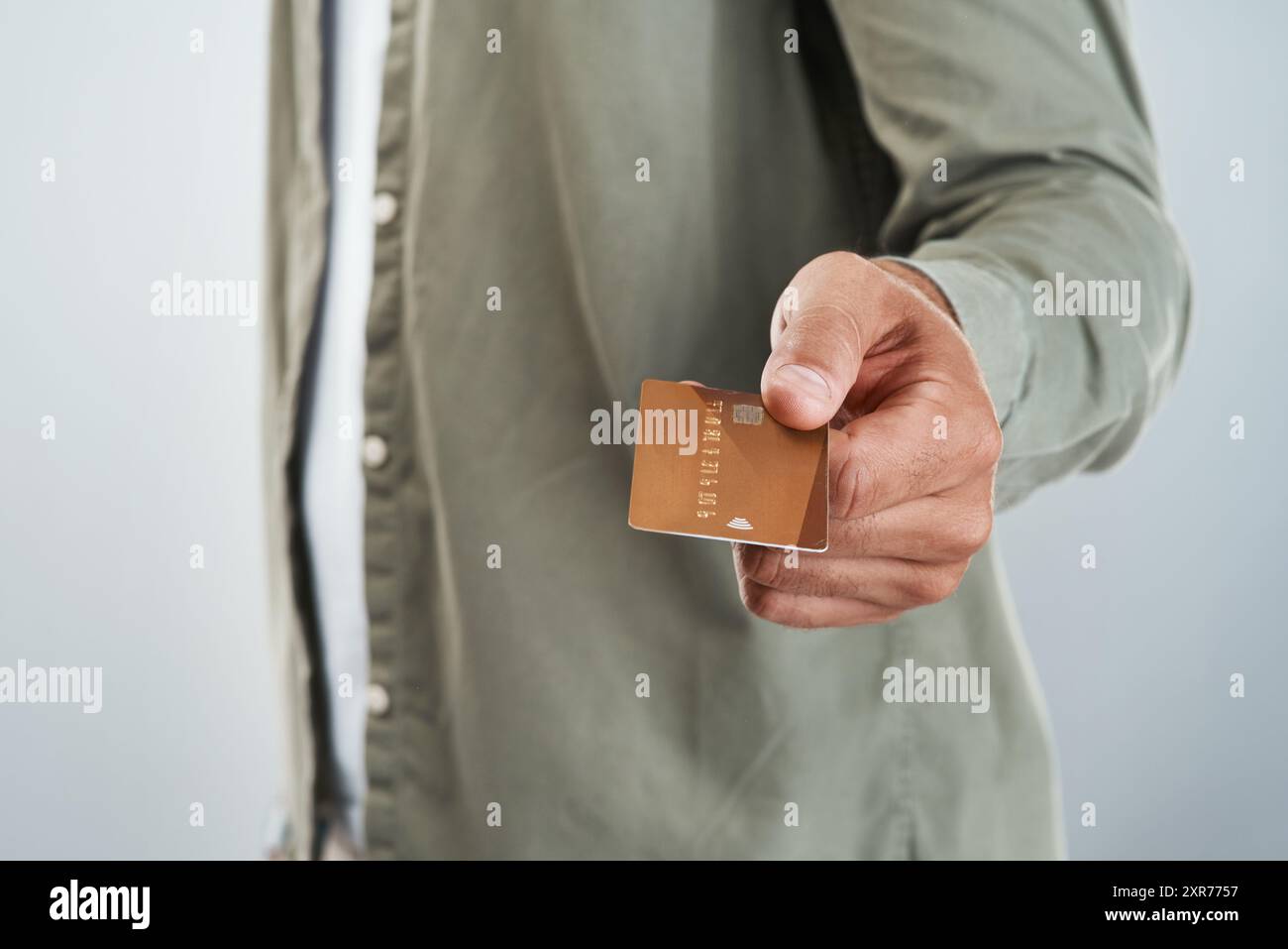 Hand, person and giving credit card for payment in studio isolated on ...