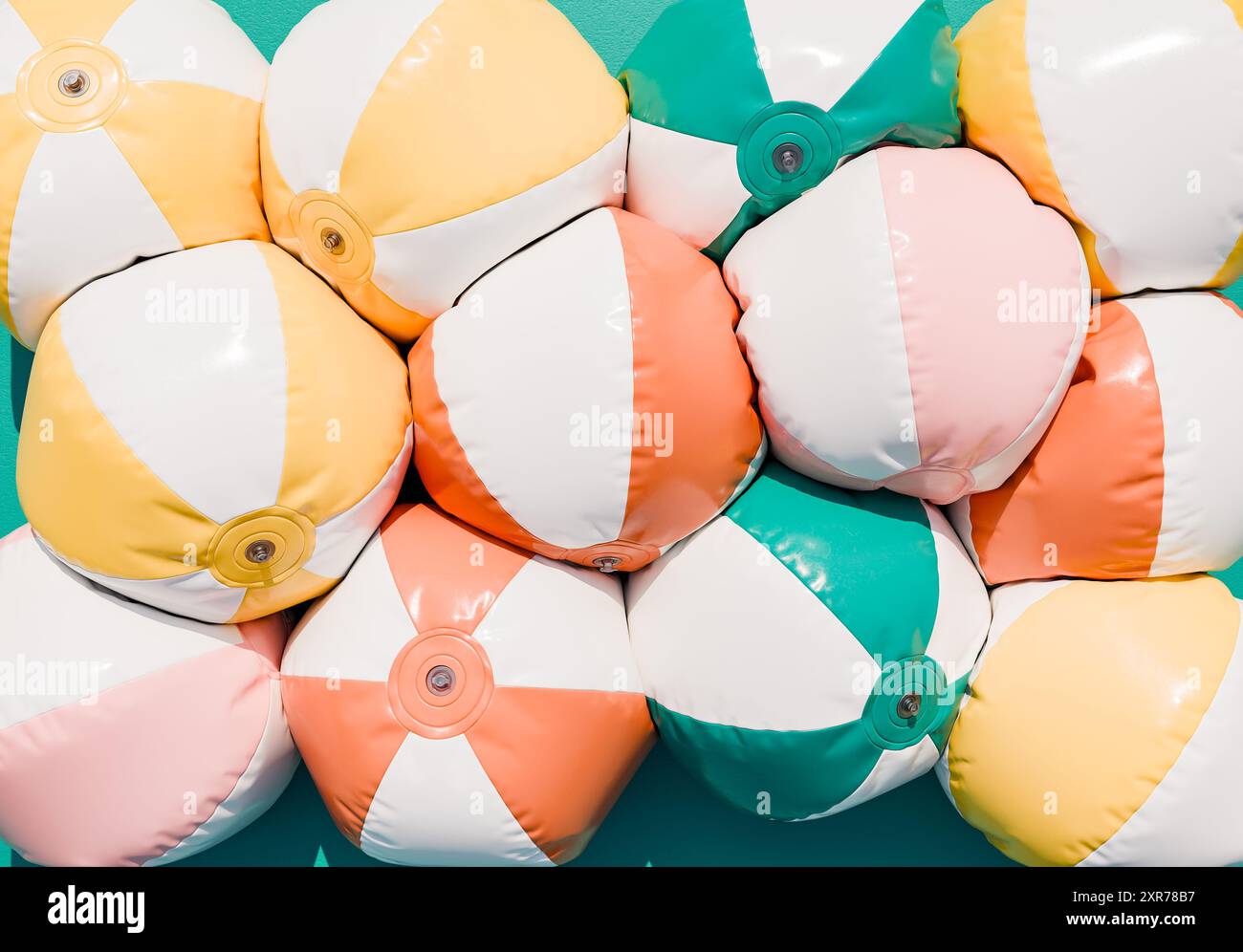 3D rendering of a playful and colorful pile of inflated beach balls ...