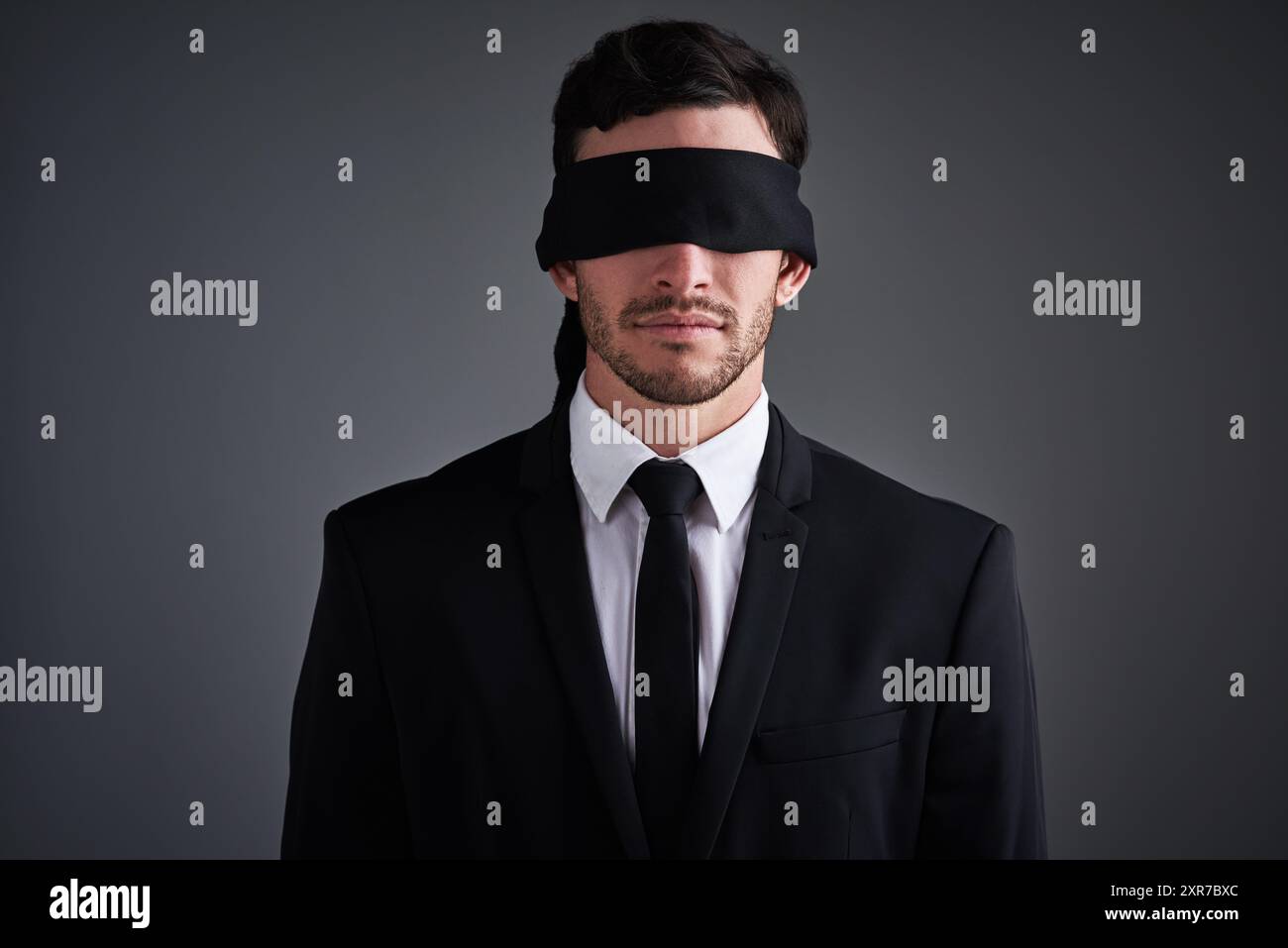 Dark, business and man with blindfold in studio for challenge, control ...