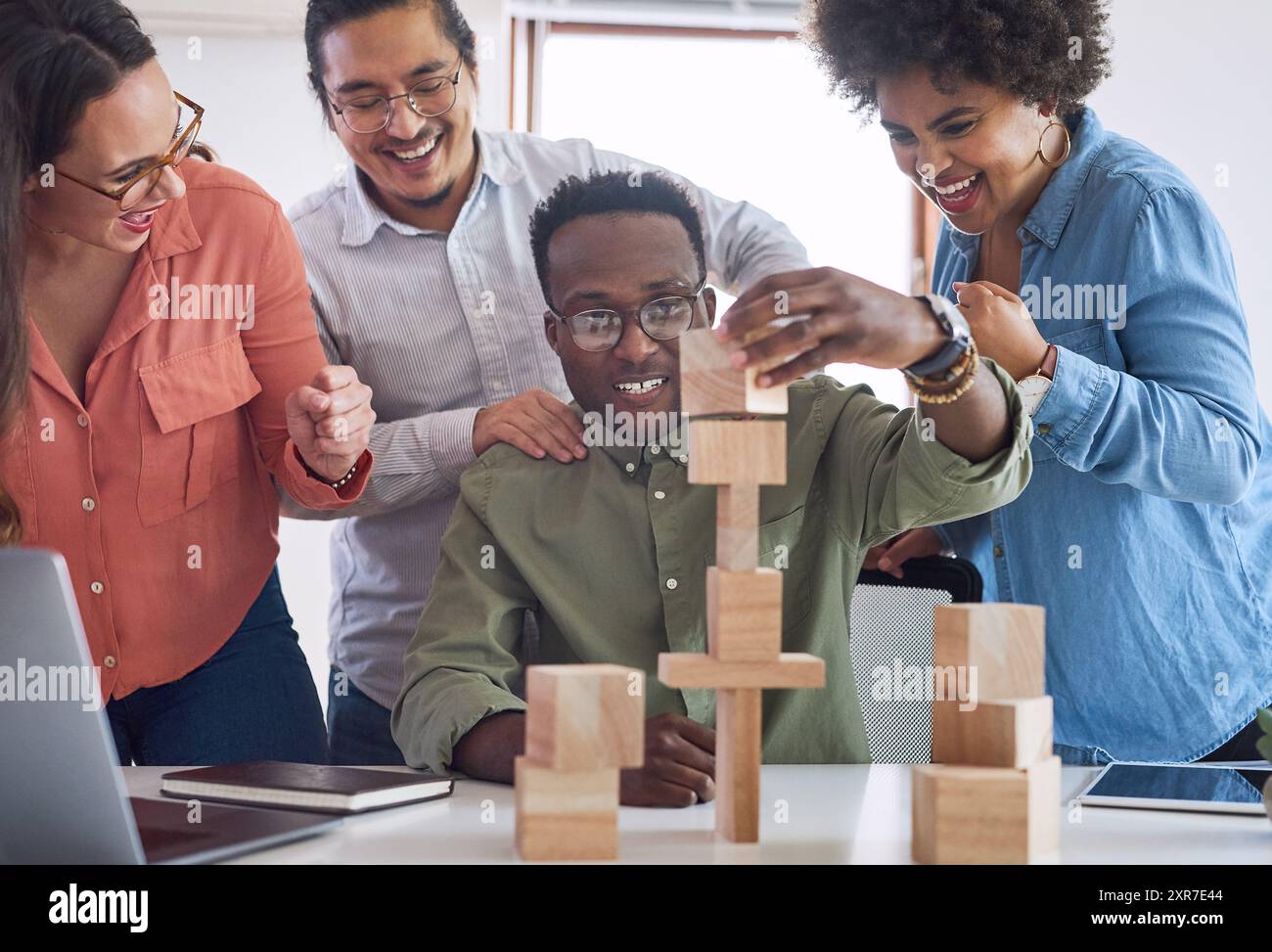 Office, employees and happy on teamwork with building blocks for ...