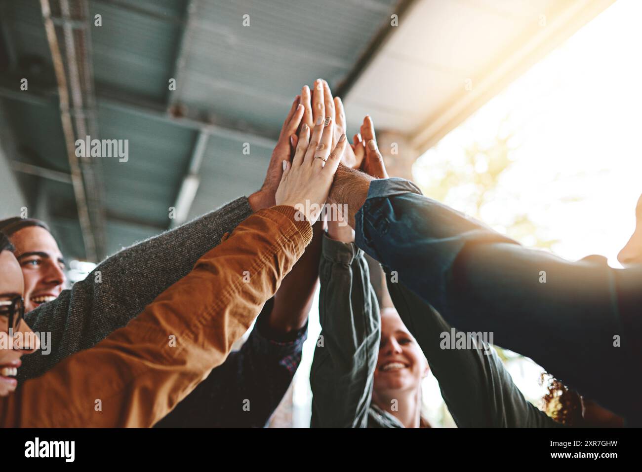 Happy, people and high five for teamwork outdoor with education success ...