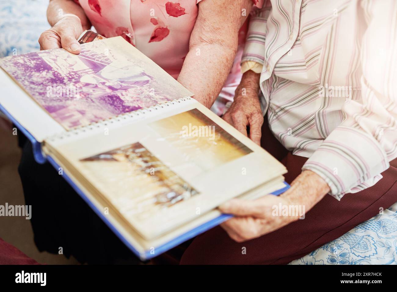 Photo album, hands and senior friends in house for memory, remember or ...