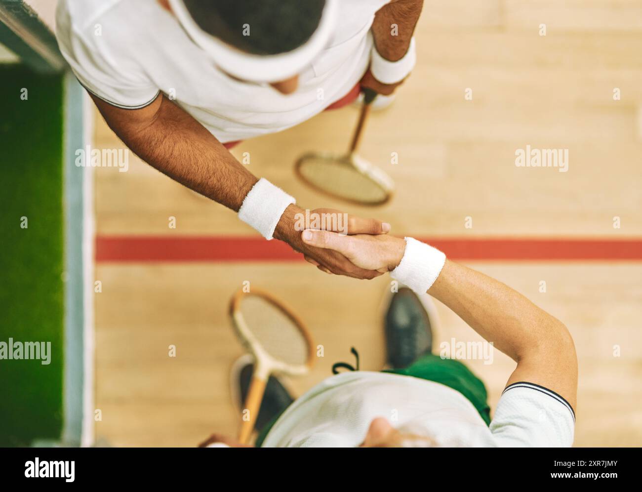 Man, friends and above with handshake in sports game for squash match ...