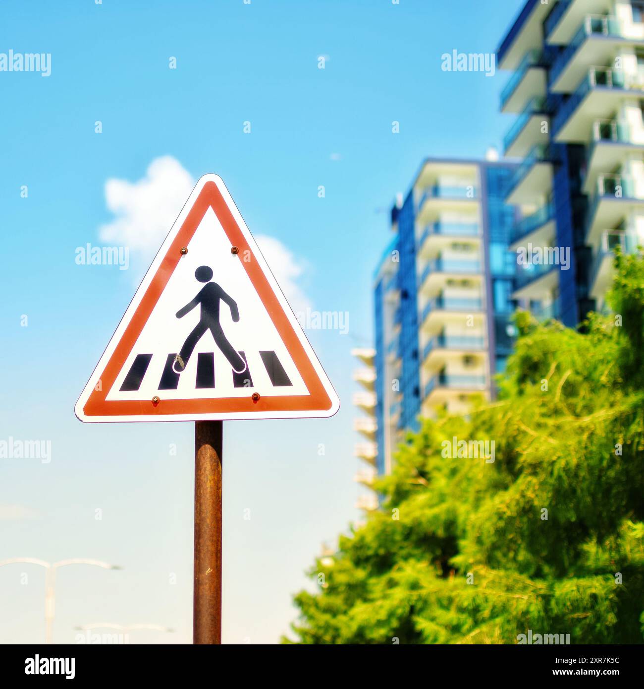 Urban landscape with a zebra crossing triangle road sign Stock Photo ...