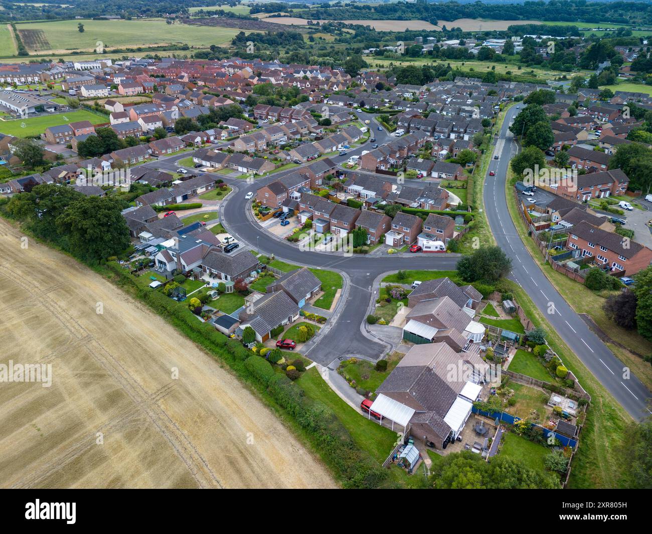 Aerial view of a suburban housing development bordering farmland ...