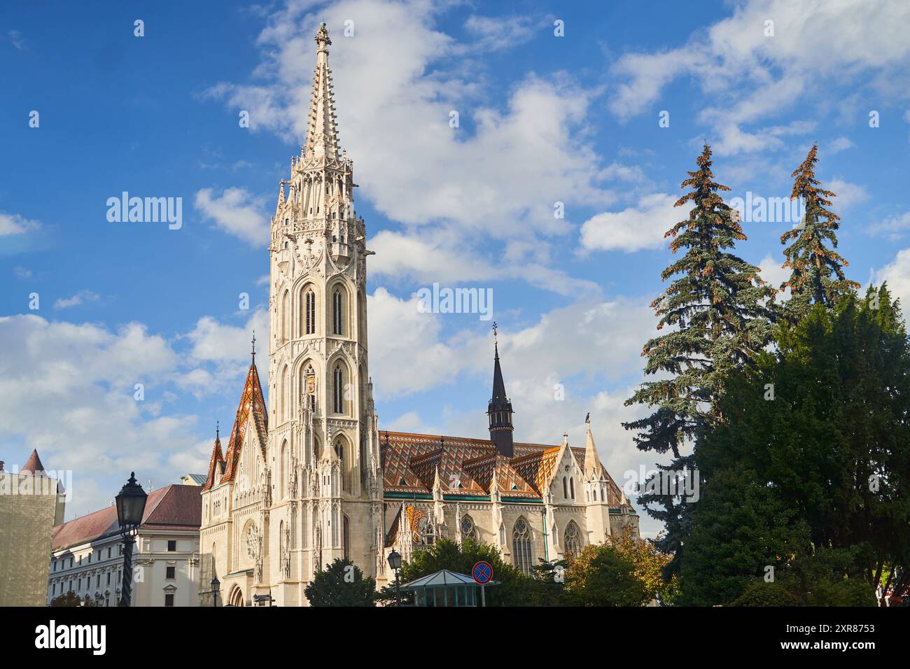 The beautiful Gothic cathedral features a tall spire, surrounded by a ...