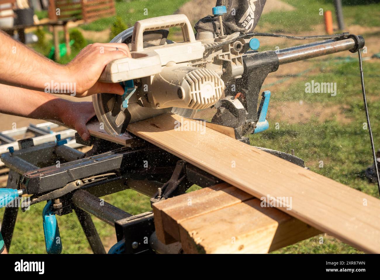 Cutting wooden plank electric saw hi-res stock photography and images ...