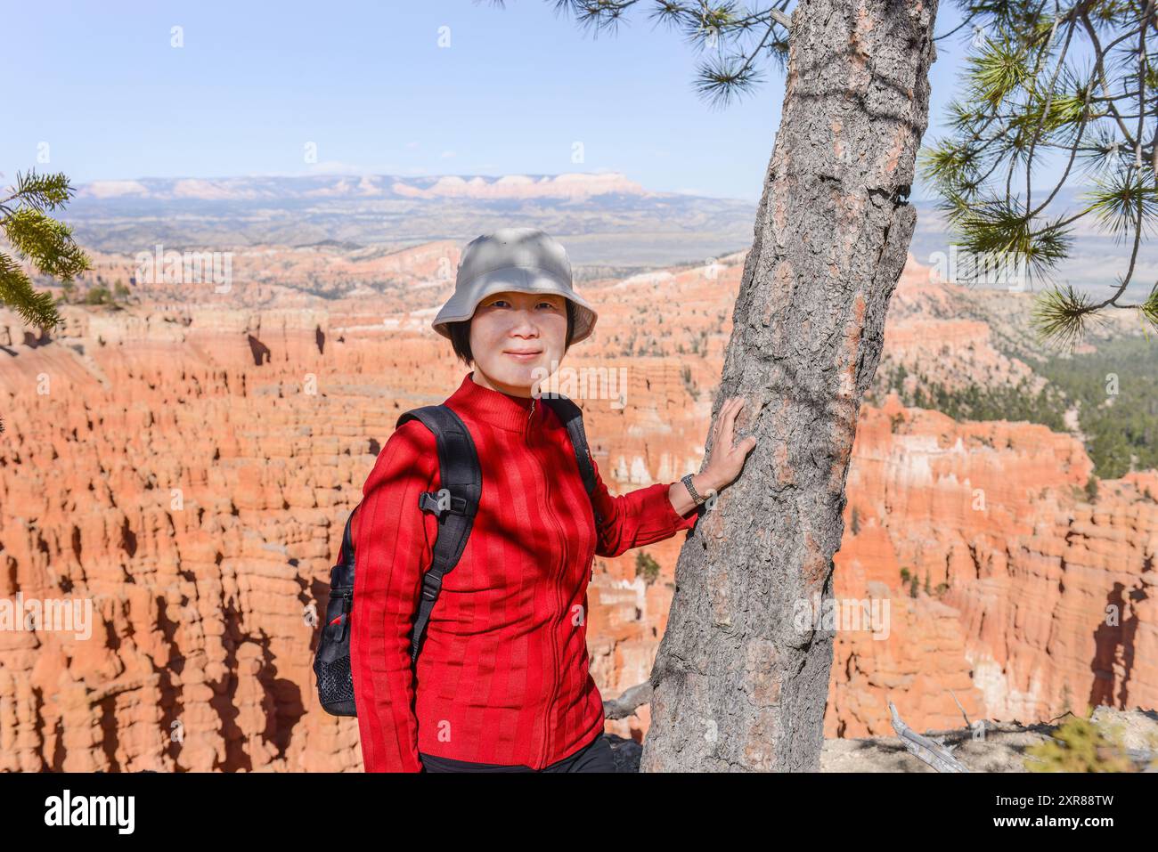 Female tourist posing for photos at Bryce Canyon Rim Trail. Utah. USA ...
