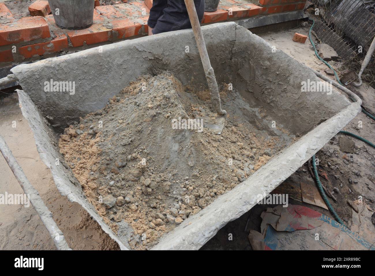 Construction workers prepare concrete mixing sand and cement Stock ...