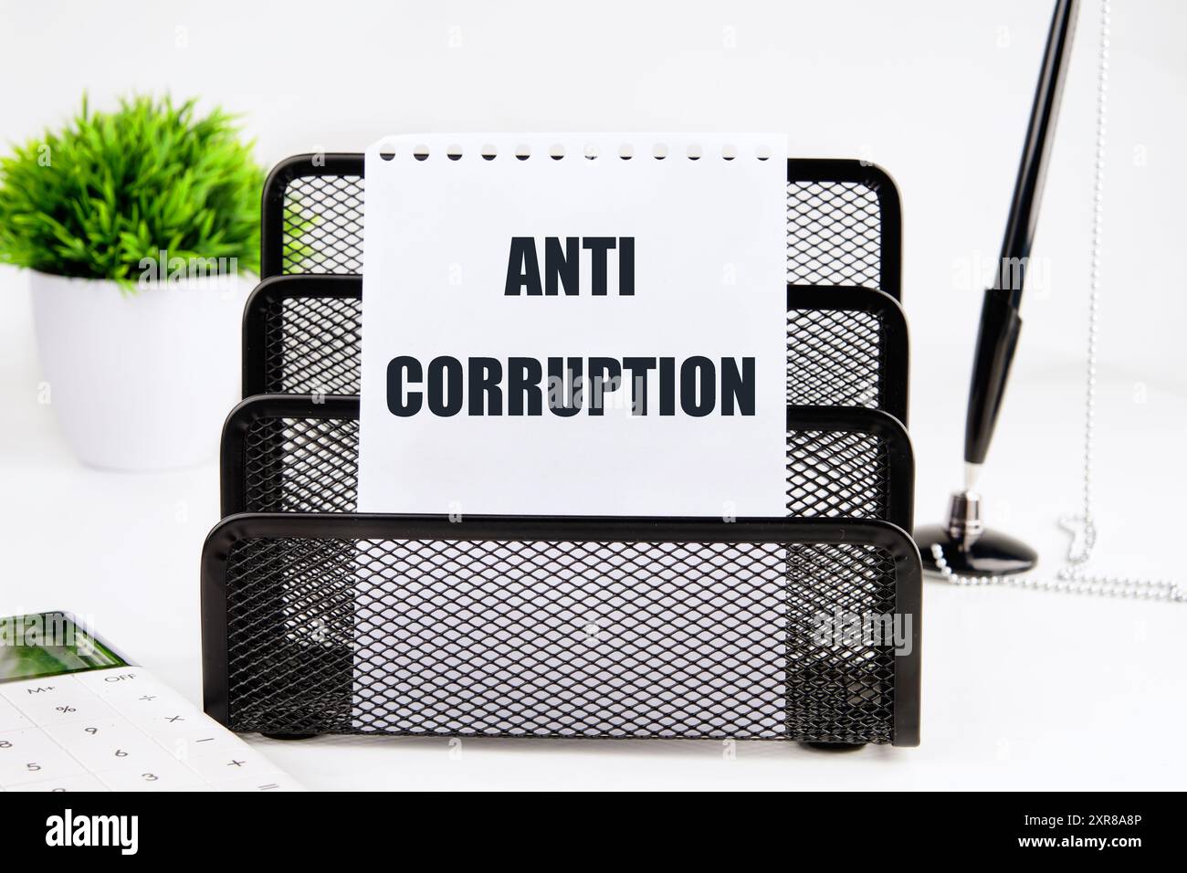 Bribery and corruption concept. Words ANTI CORRUPTION on a piece of ...