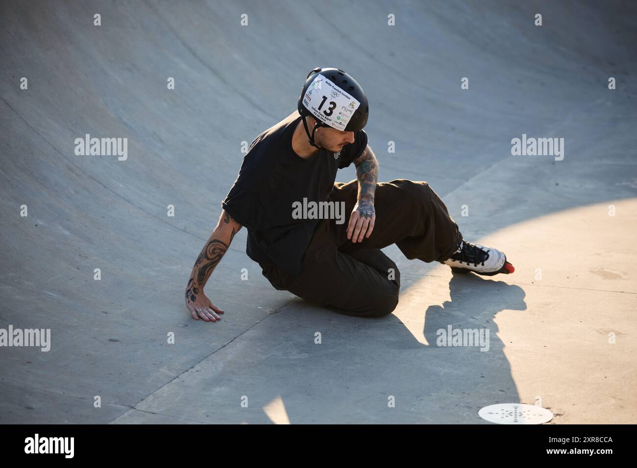 Roller blader fall in a skate pool. Inline skater crashed in a concrete ...