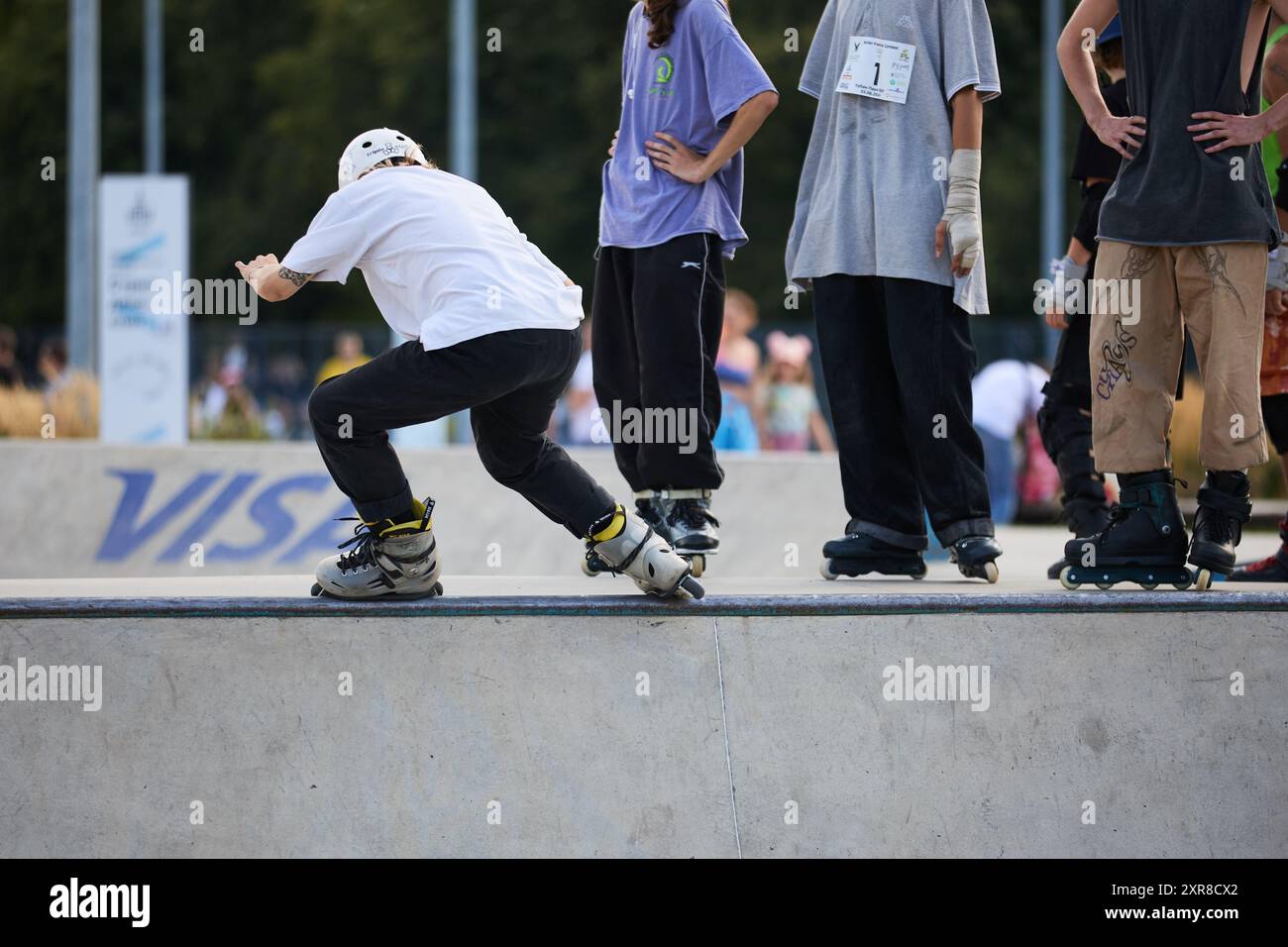 Roller blader performing kindgrind trick in a skatepark. Kyiv - 4 ...