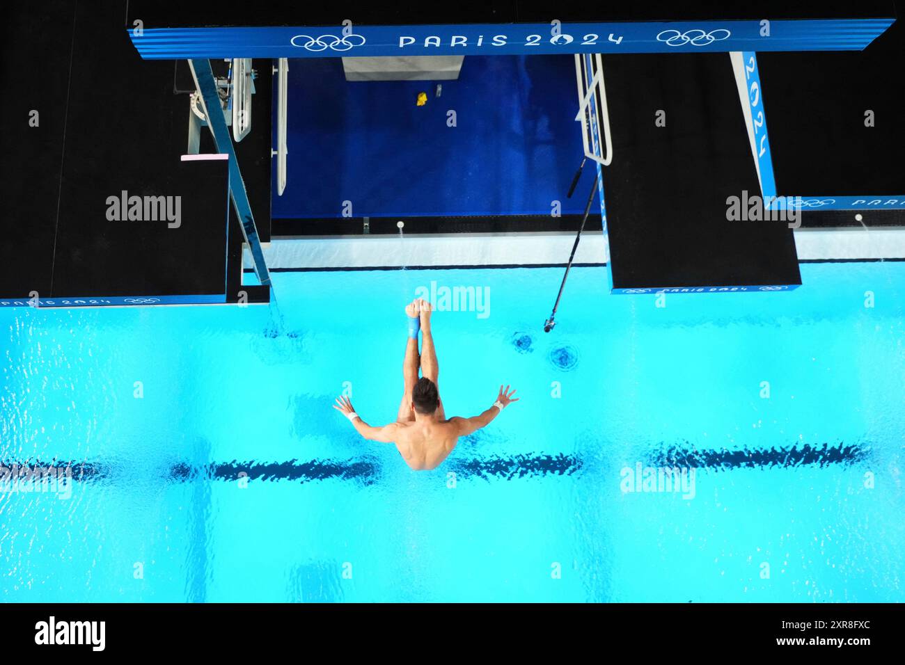 A competitor dives during the men's 10m platform preliminary diving ...