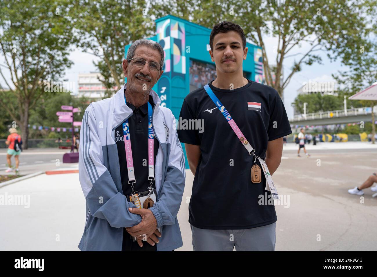 Yemeni swimmer Yusuf Marwan, right, poses for a photo with his coach ahead of his first Olympic ...