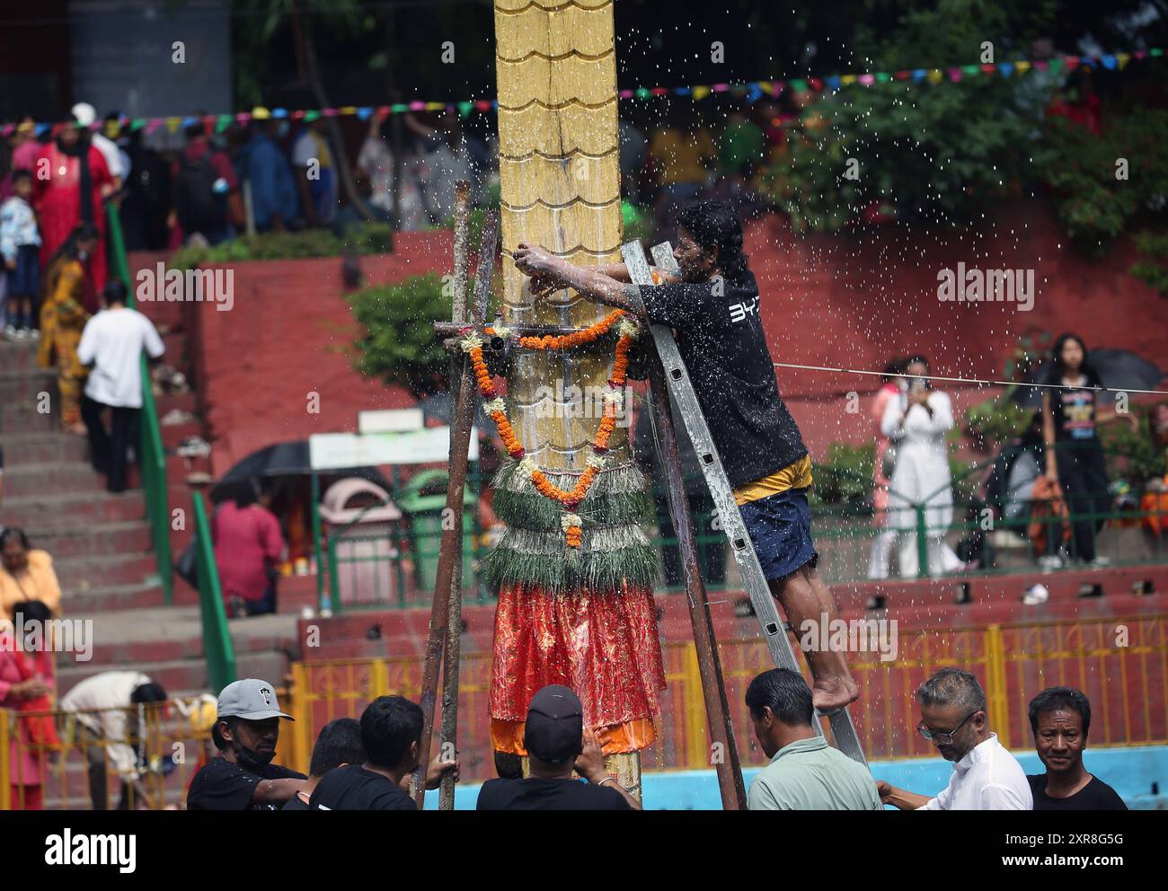 August 9, 2024: Devotees offer prayers on a statue of snake in ...