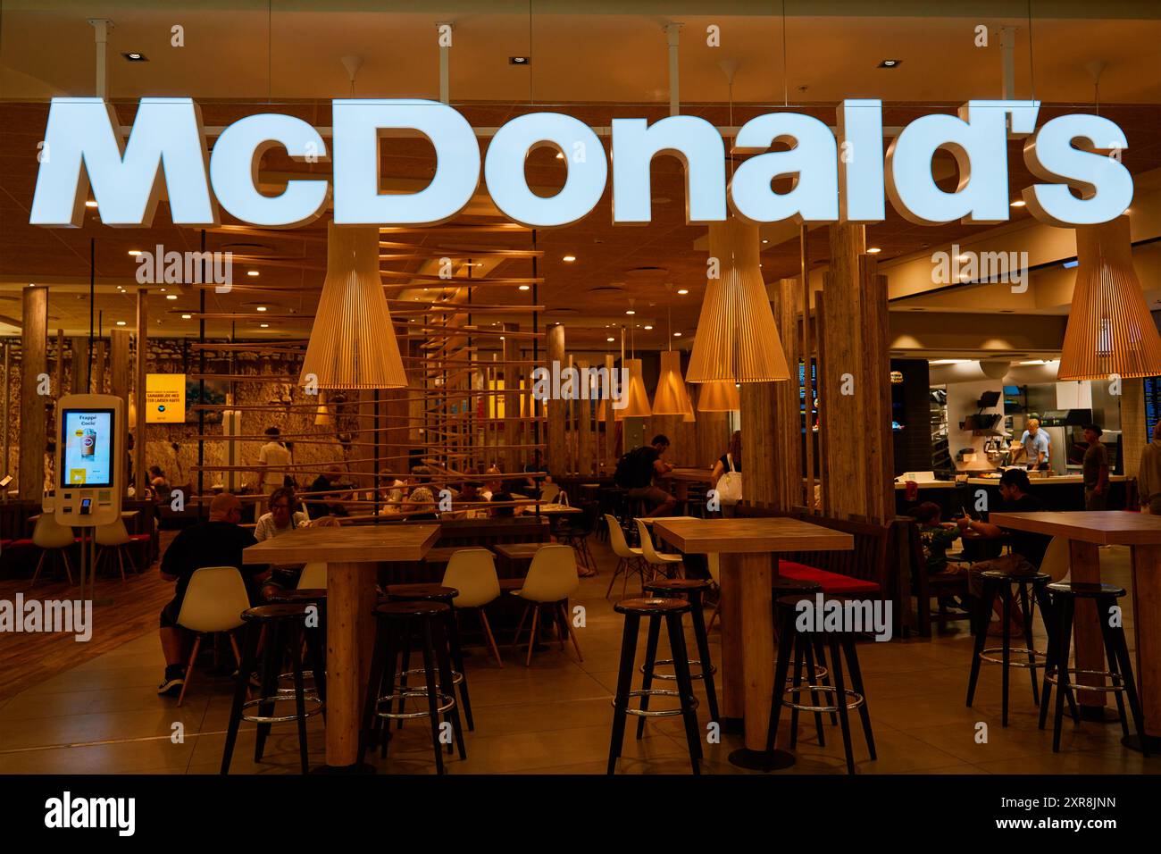 Inside view of McDonald's restaurant with contemporary wooden decor ...