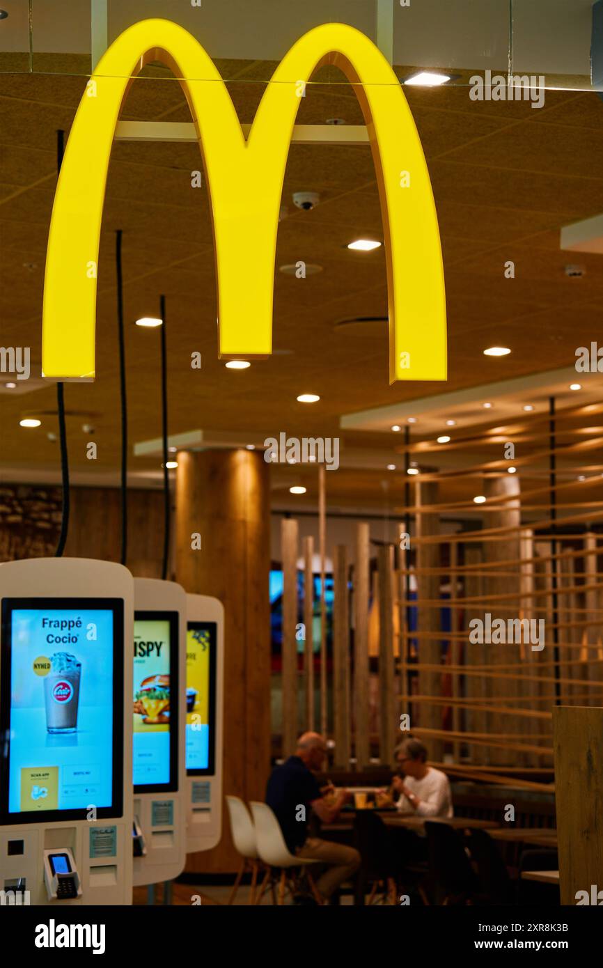 Inside view of McDonald's restaurant with contemporary wooden decor ...