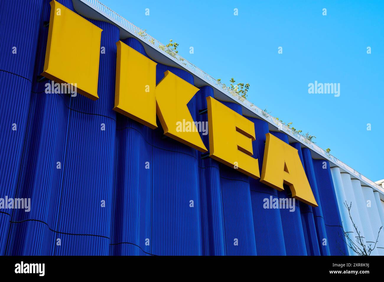 Exterior of IKEA storefront with bold yellow lettering on modern ...