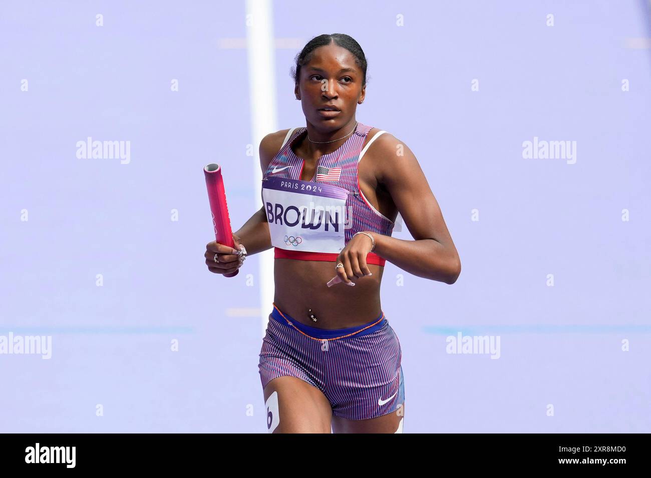 Kaylyn Brown, of the United States crosses the finish line to win a ...