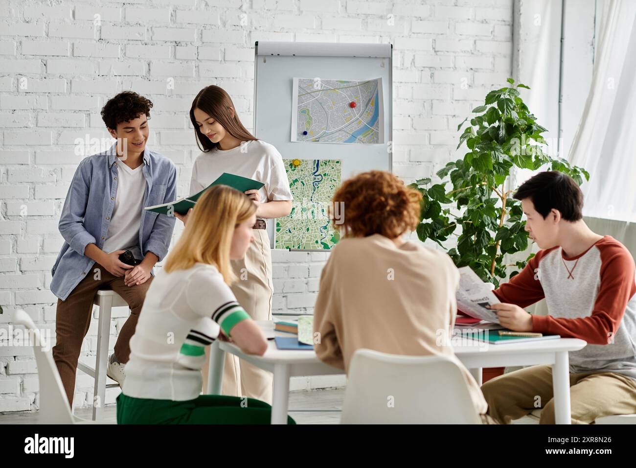 Group teenagers working together hi-res stock photography and images ...