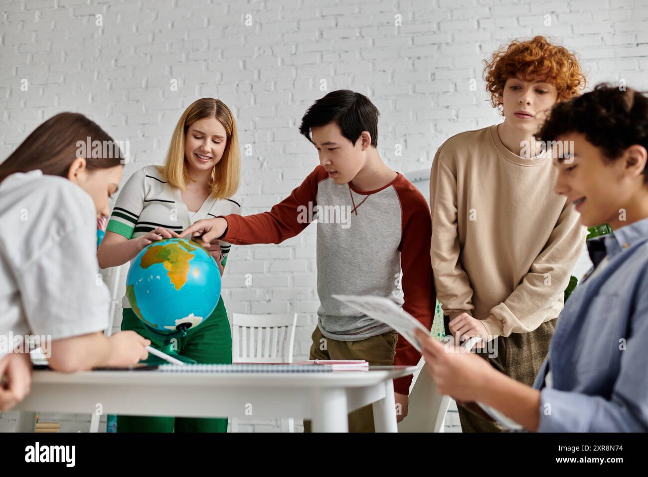 Teenagers participate in a Model UN simulation, engaging in a ...