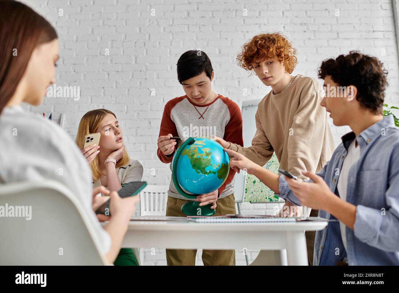 Teens simulate Model UN session, debating global issues with globe ...