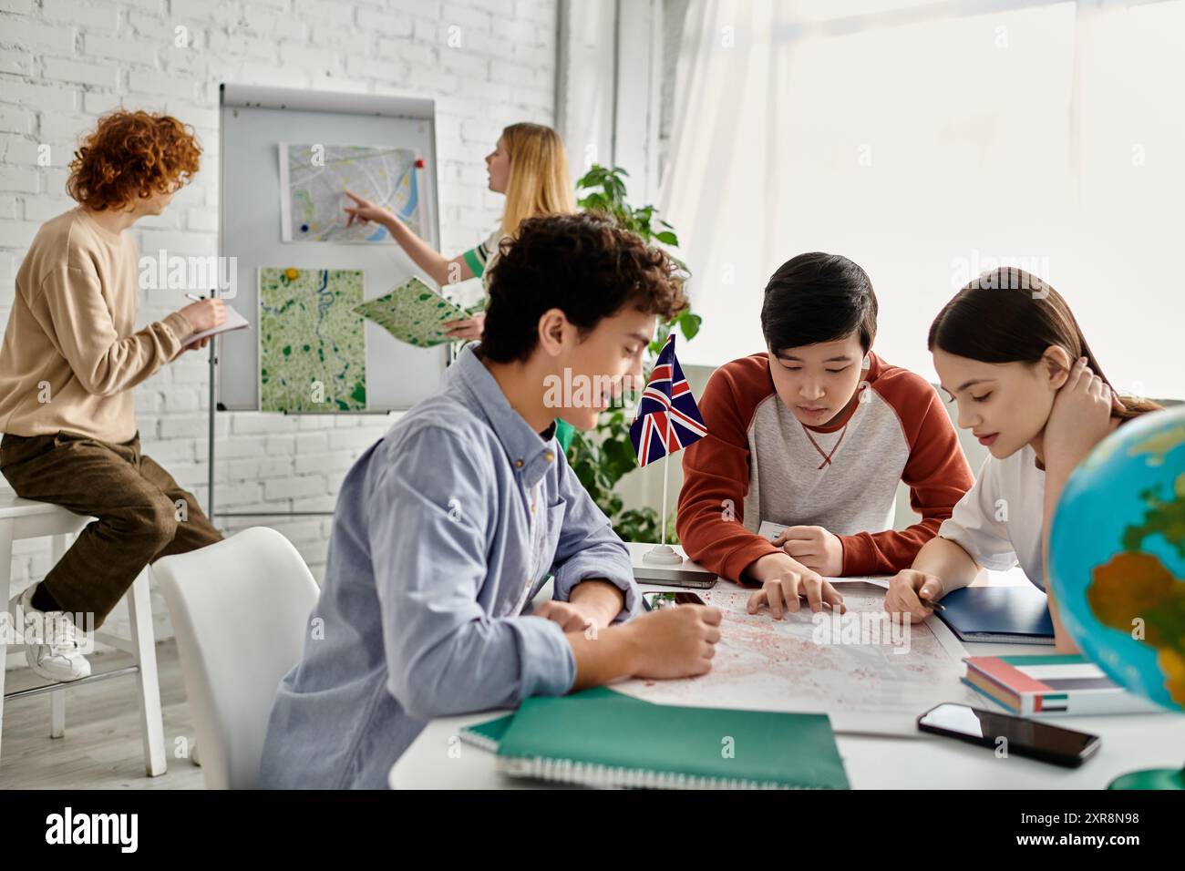 Gather around map hi-res stock photography and images - Alamy