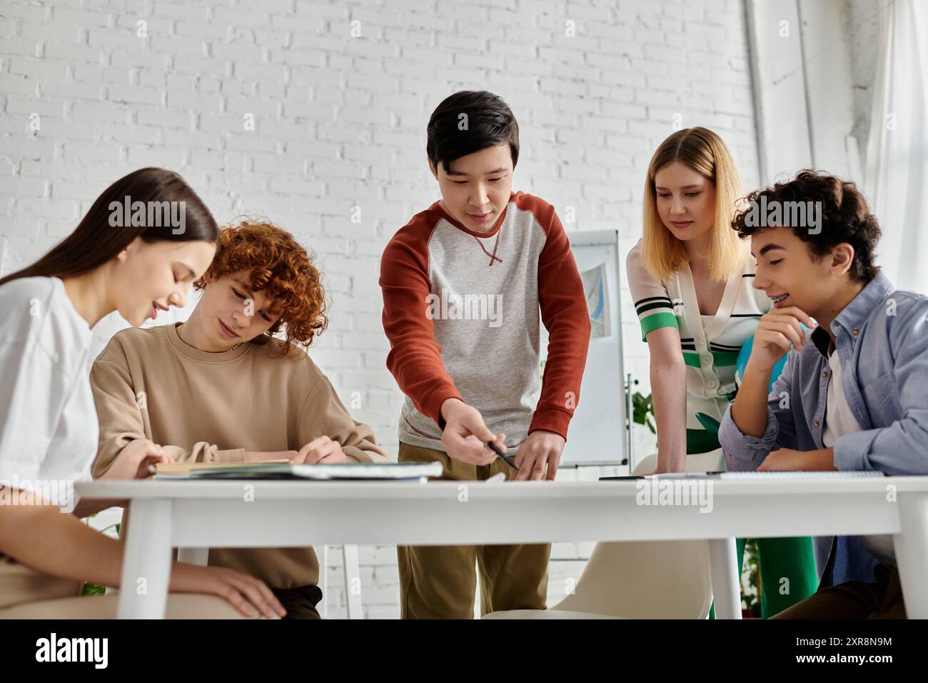 A group of teenagers work together at a UN model conference Stock Photo ...