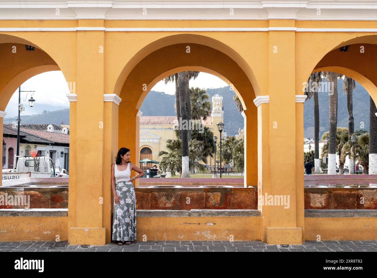 Solo Female Traveler Exploring the Iconic Yellow Arches of Antigua ...