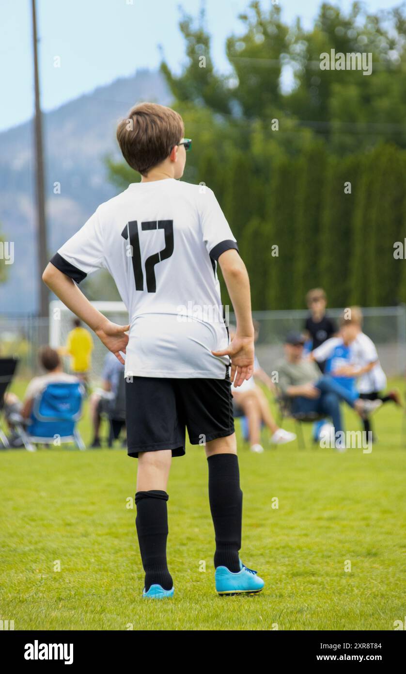 Youth soccer player number 17 on field during game Stock Photo - Alamy