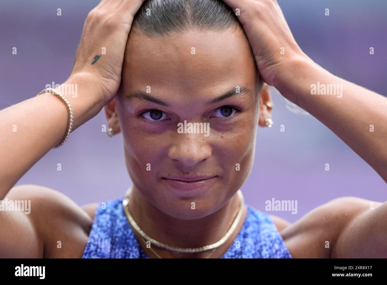 Anna Hall, of the United States, reacts after her throw in the women's ...