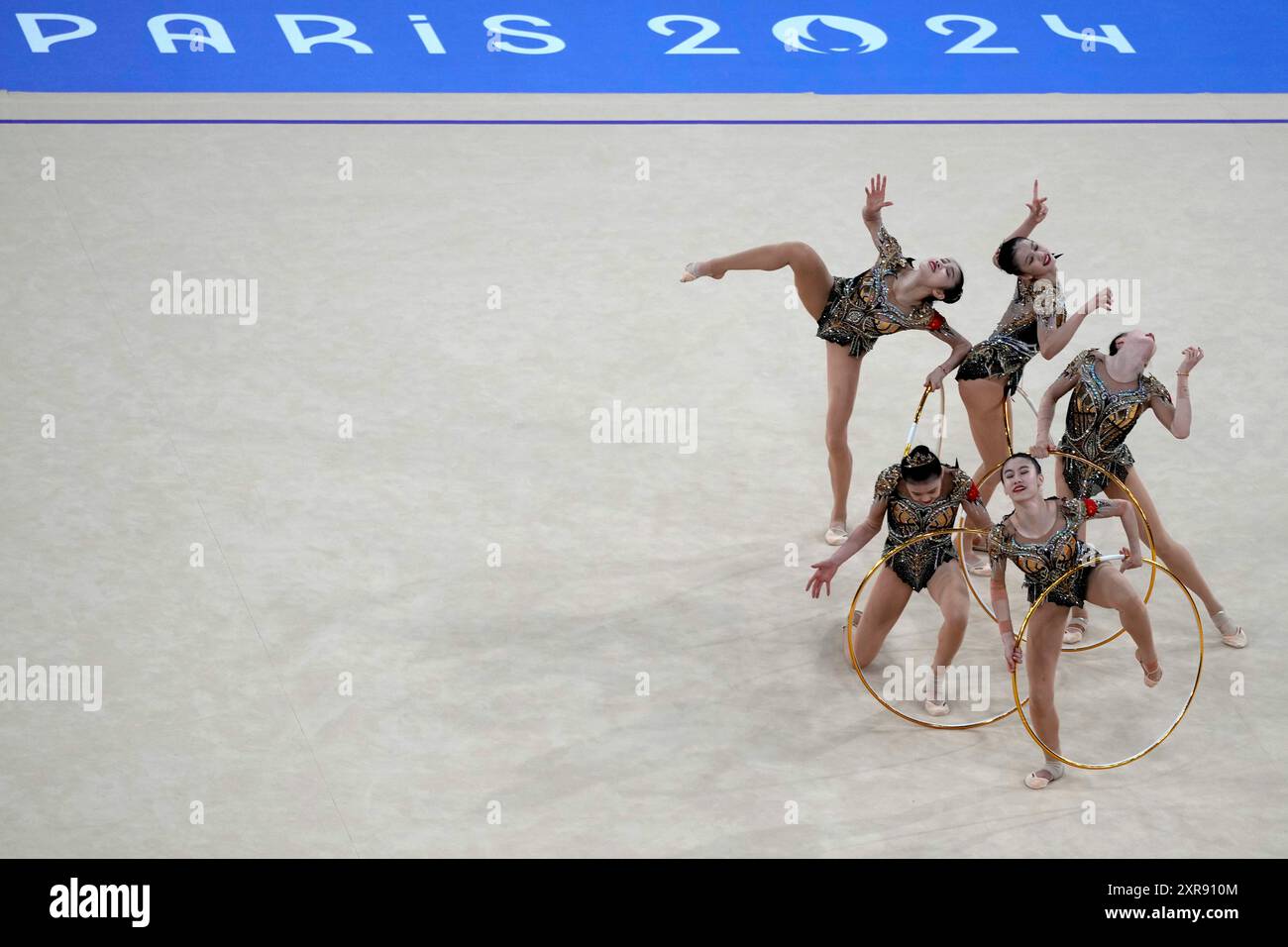 The team from China perform their hoop exercise in the rhythmic ...