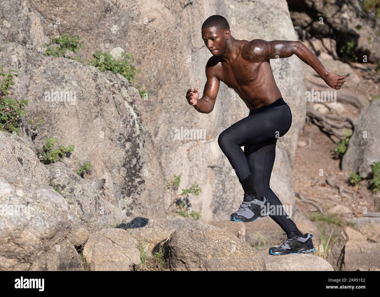 Black man trail runs in Colorado Stock Photo - Alamy