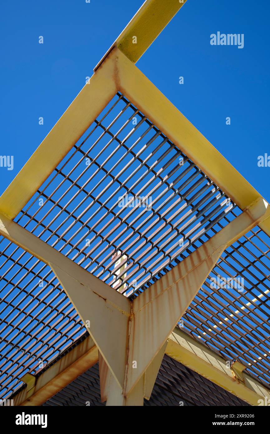 Industrial grate walkway catwalk yellow support beams on a deep Stock ...