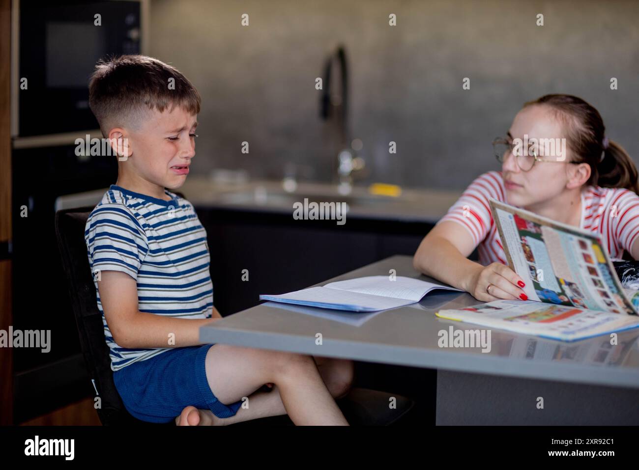 Boy having problems in finishing homework Stock Photo - Alamy