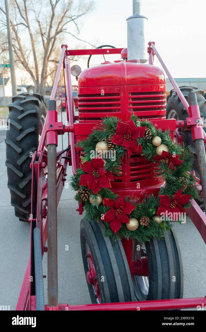 Red tractor decorated with a Christmas wreath Stock Photo - Alamy